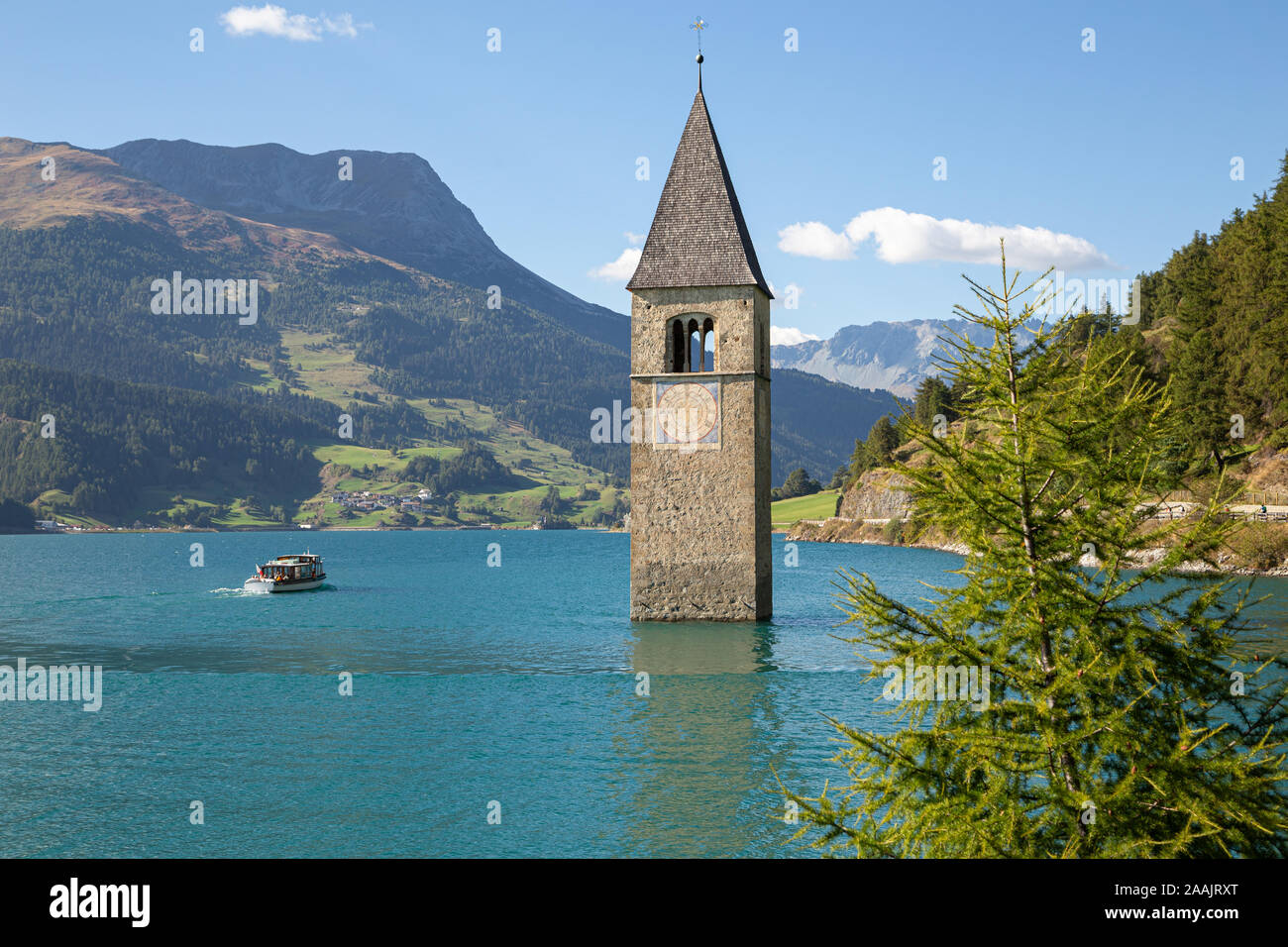 The bell tower submerged by the water in the Resia lake. Alps, Italy ...