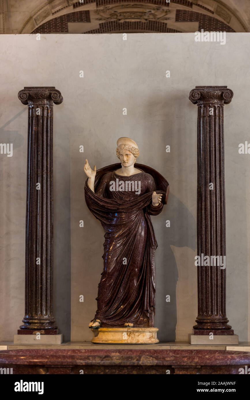 A greek statue and two poles in the Louvre Museum, the world's largest ...