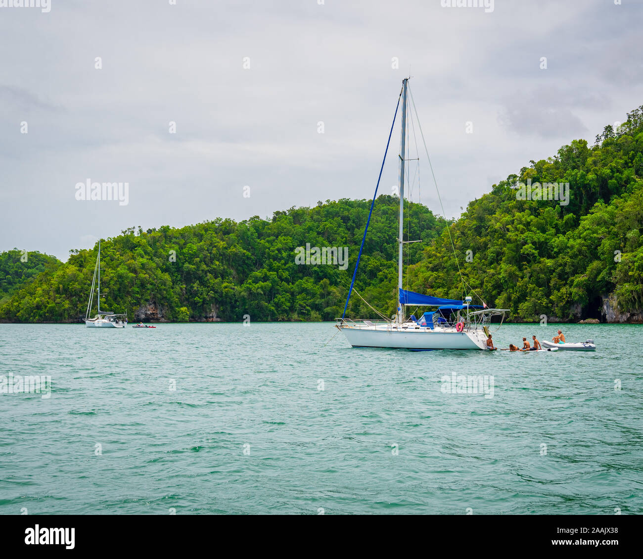Luxury boat anchored close to exotic tropical island. Panoramic ...
