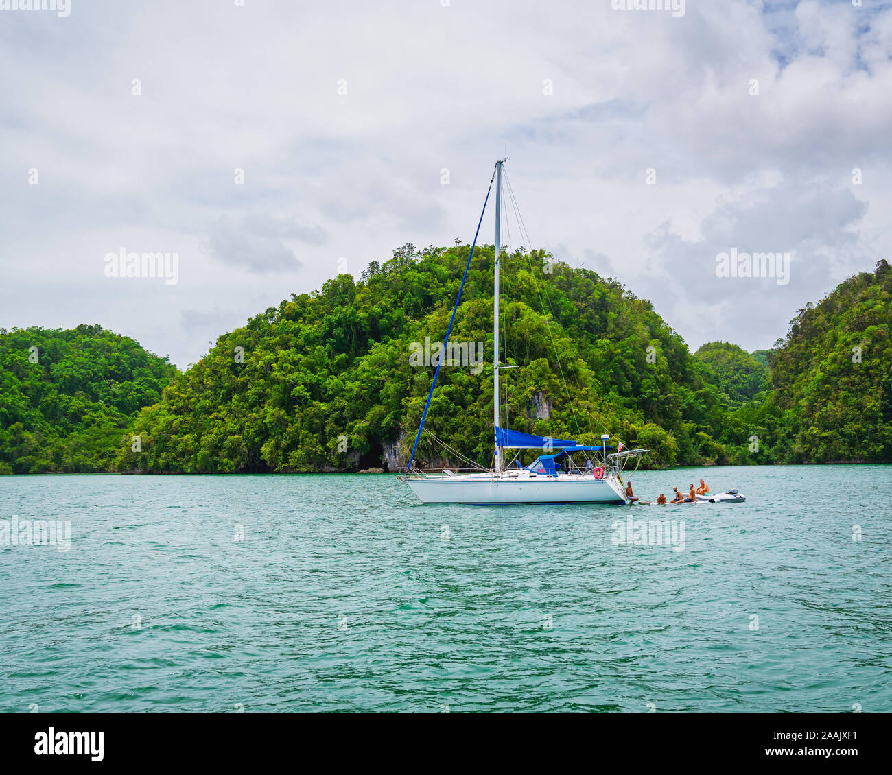 Luxury boat anchored close to exotic tropical island. Panoramic ...
