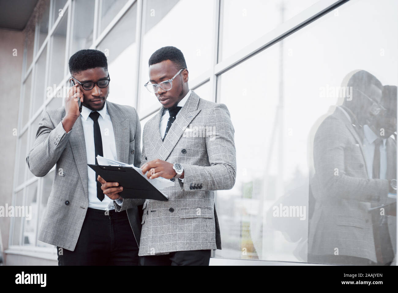 Business communication. Two cheerful business men talking to each other ...