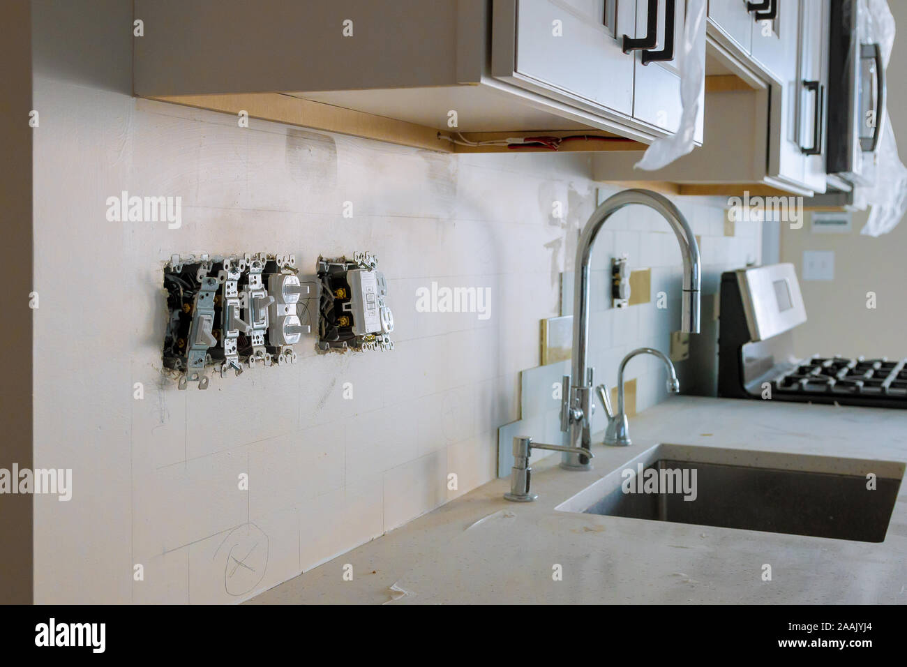 Work on installing electrical outlets with electrical wires and ...