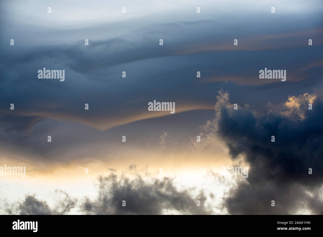 Weird shaped clouds over Ambleside at dusk, Lake District, UK Stock ...