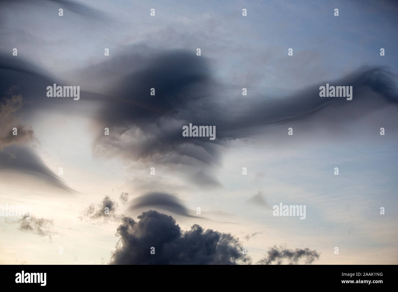 Weird shaped clouds over Ambleside at dusk, Lake District, UK Stock ...
