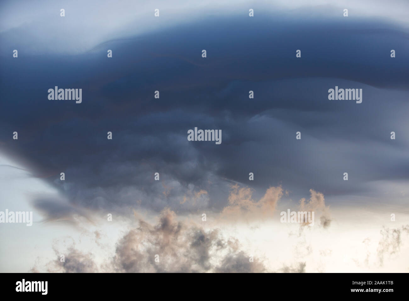Weird shaped clouds over Ambleside at dusk, Lake District, UK Stock ...