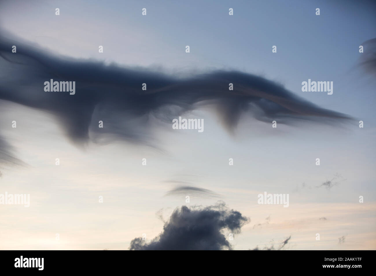 Weird shaped clouds over Ambleside at dusk, Lake District, UK Stock ...