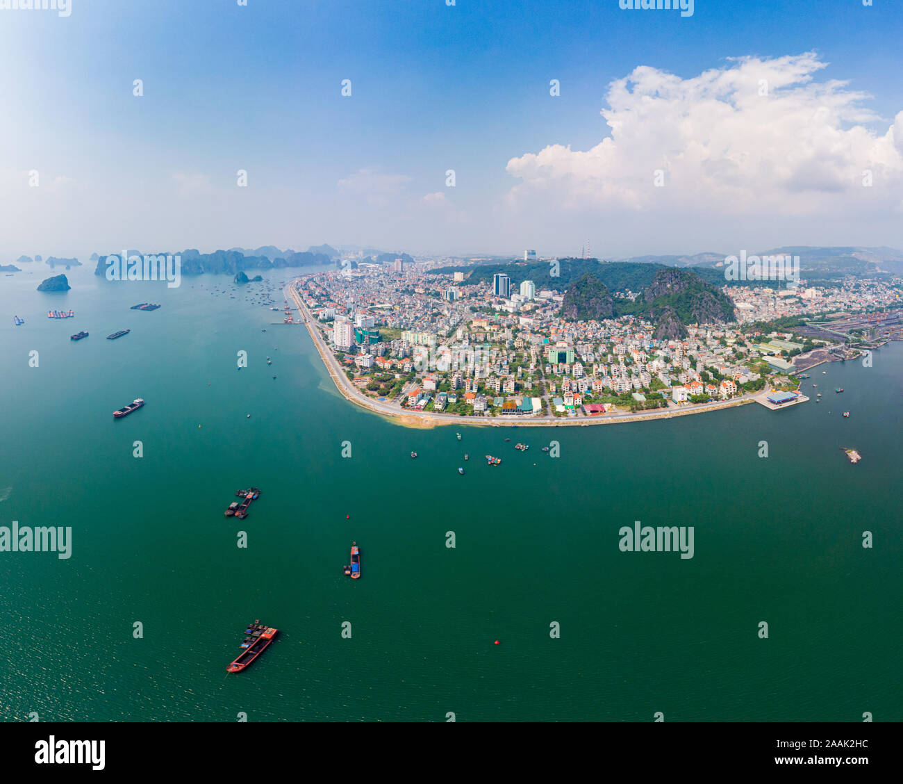 Aerial view of Ha Long Bay and Halong City skyline, unique limestone ...