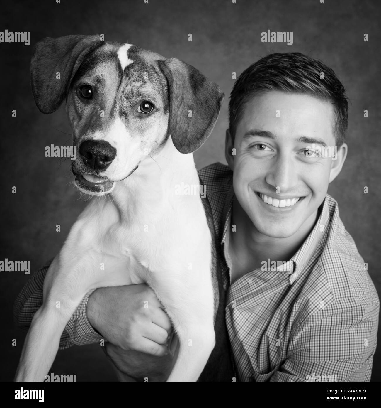 Young smiling man dog Black and White Stock Photos & Images - Alamy