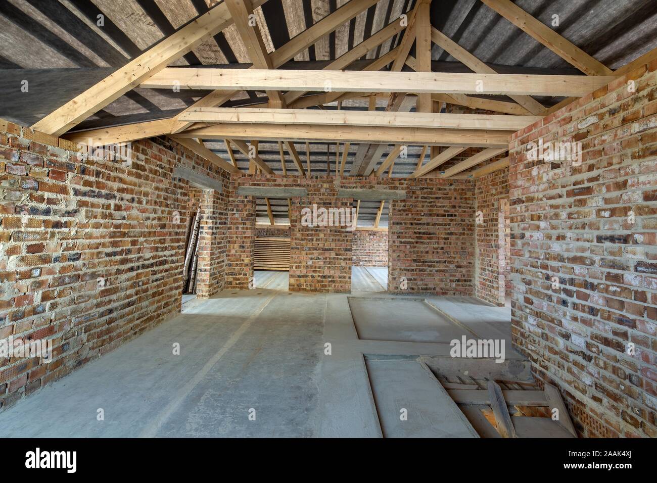 Attic of a building under construction with wooden beams of a roof ...