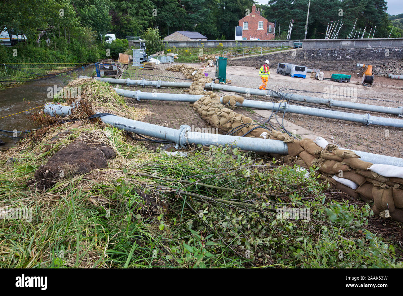 Pumping out water from Toddbrook Reservoir above Whaley Bridge in ...