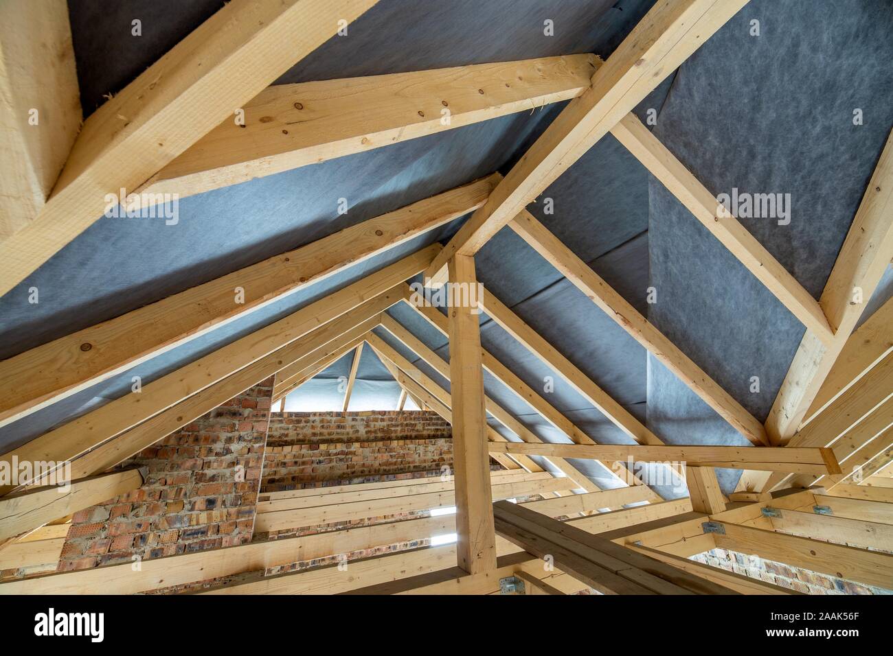 Attic space of a building under construction with wooden beams of a ...