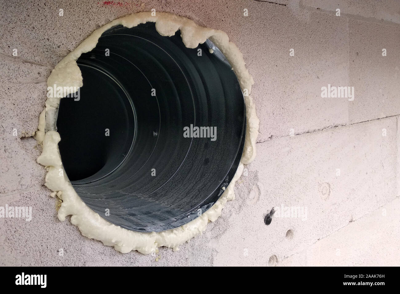 Metal ventilation pipe integrated in whine block wall under ...
