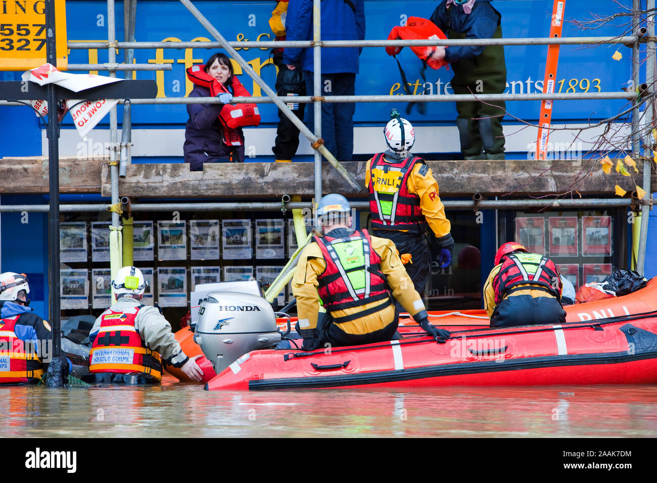 RNLI and Mountain Rescue volunteers rescuing flood victims from their ...