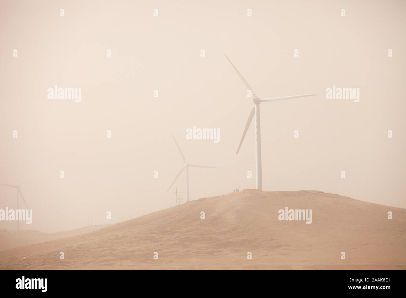 A dust storm and desertification surrounds a wind farm in Inner ...