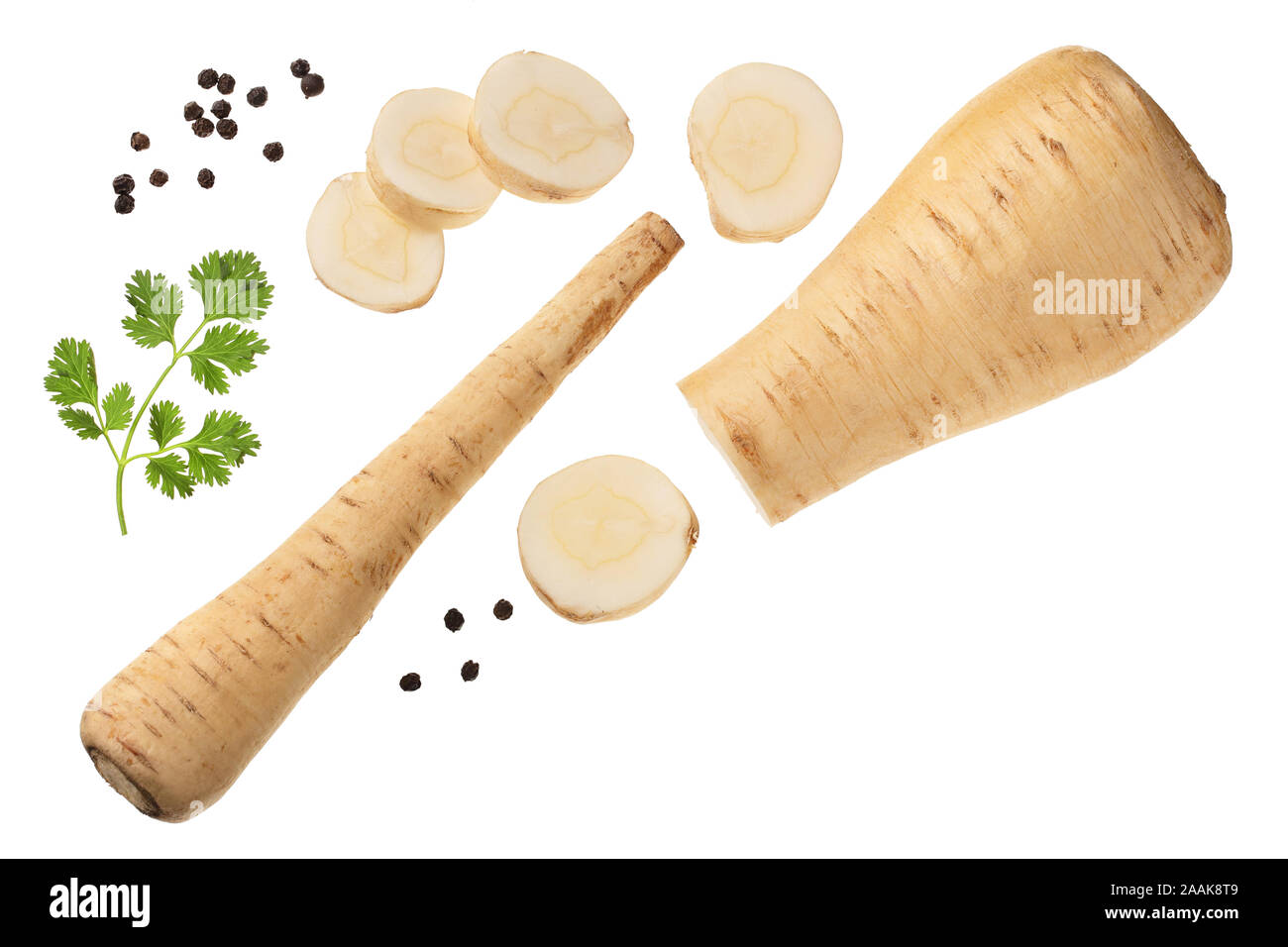 Parsnip root and slices with parsley peppercorns isolated on white ...