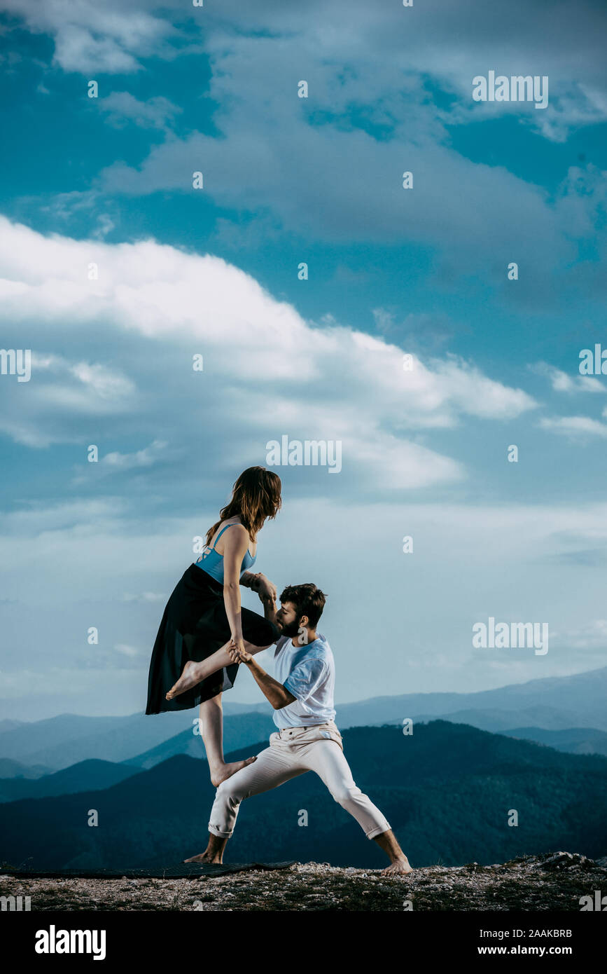 Sensual couple performing an artistical and emotional contemporary ...