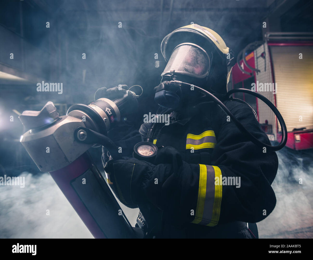 Portrait of a female firefighter wearing a helmet and all safety ...