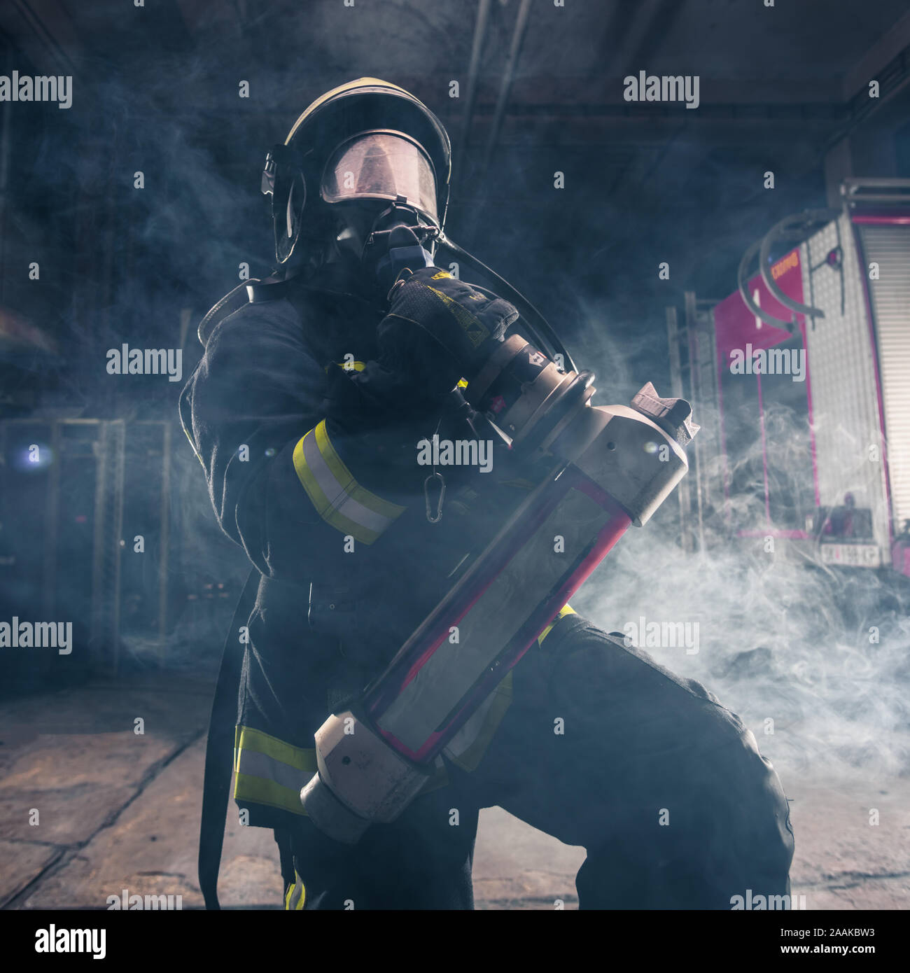Portrait of a female firefighter wearing a helmet and all safety ...