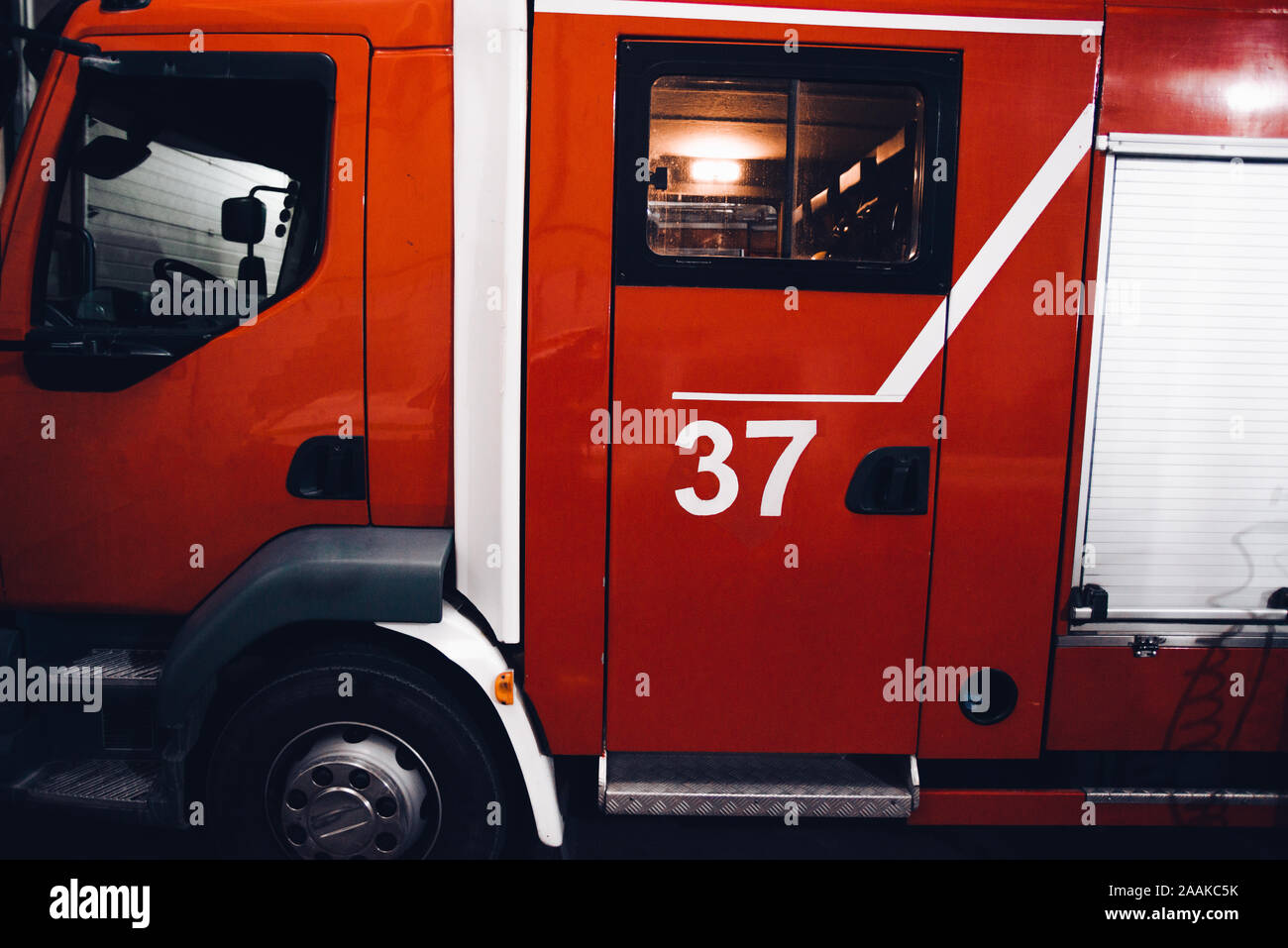 Multiple fire trucks parked in a garage used for firefighting ...