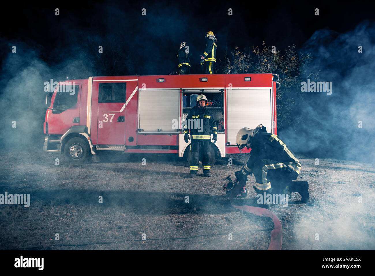 Fire station crew responding to fire emergency situation Stock Photo ...