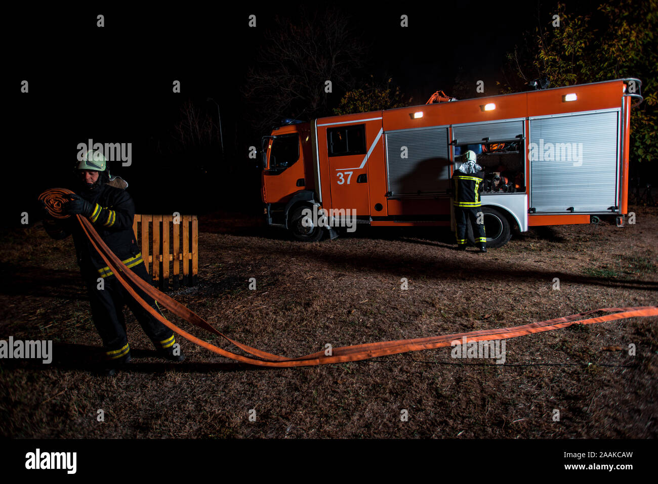 Fire department in the field during a fire emergency situation Stock ...