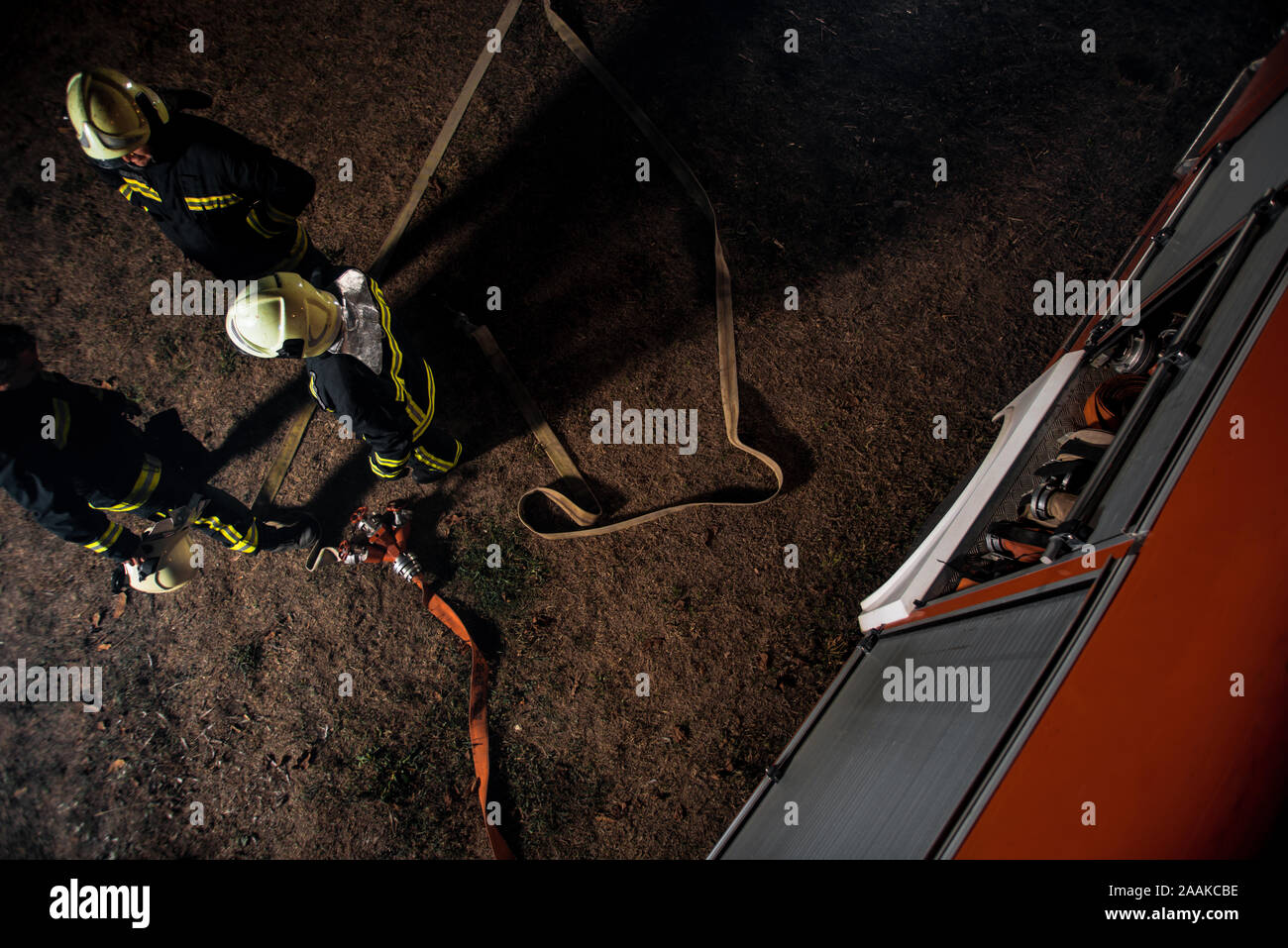 Firemen getting ready during a firefighting intervention Stock Photo ...