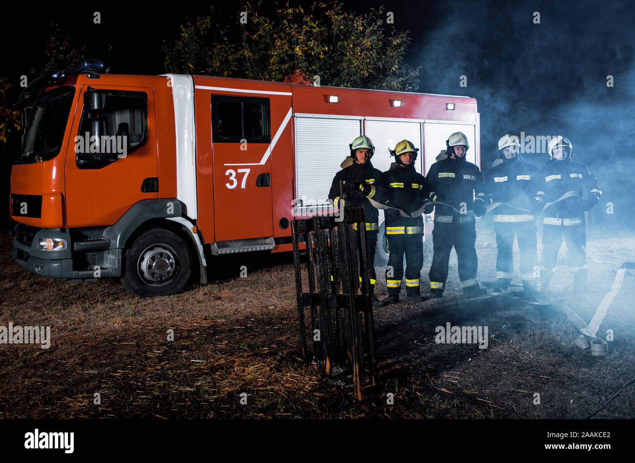 Firefighters preparing various tools used for eliminating fire hazards ...