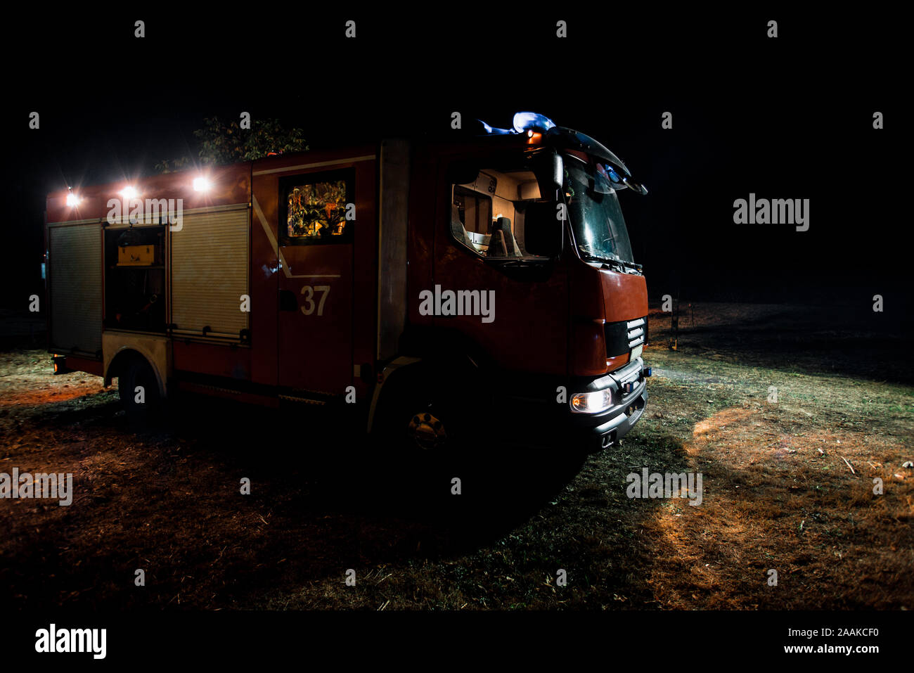 Firefighting vehicle responding to fire emergency situation Stock Photo ...