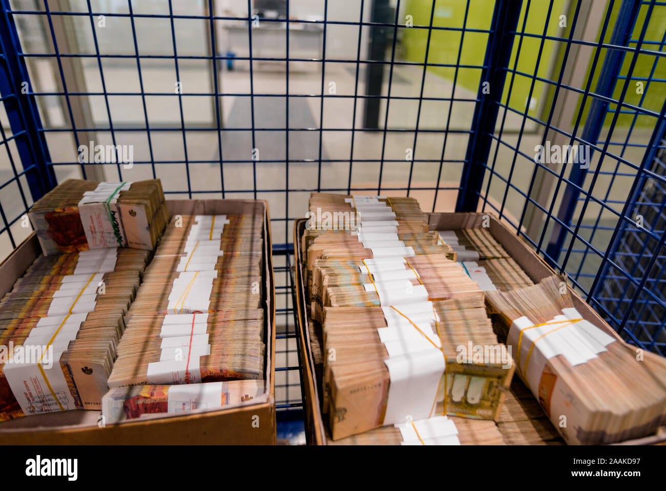 Metal blue cage that is used for storage and trasnportation of boxes ...