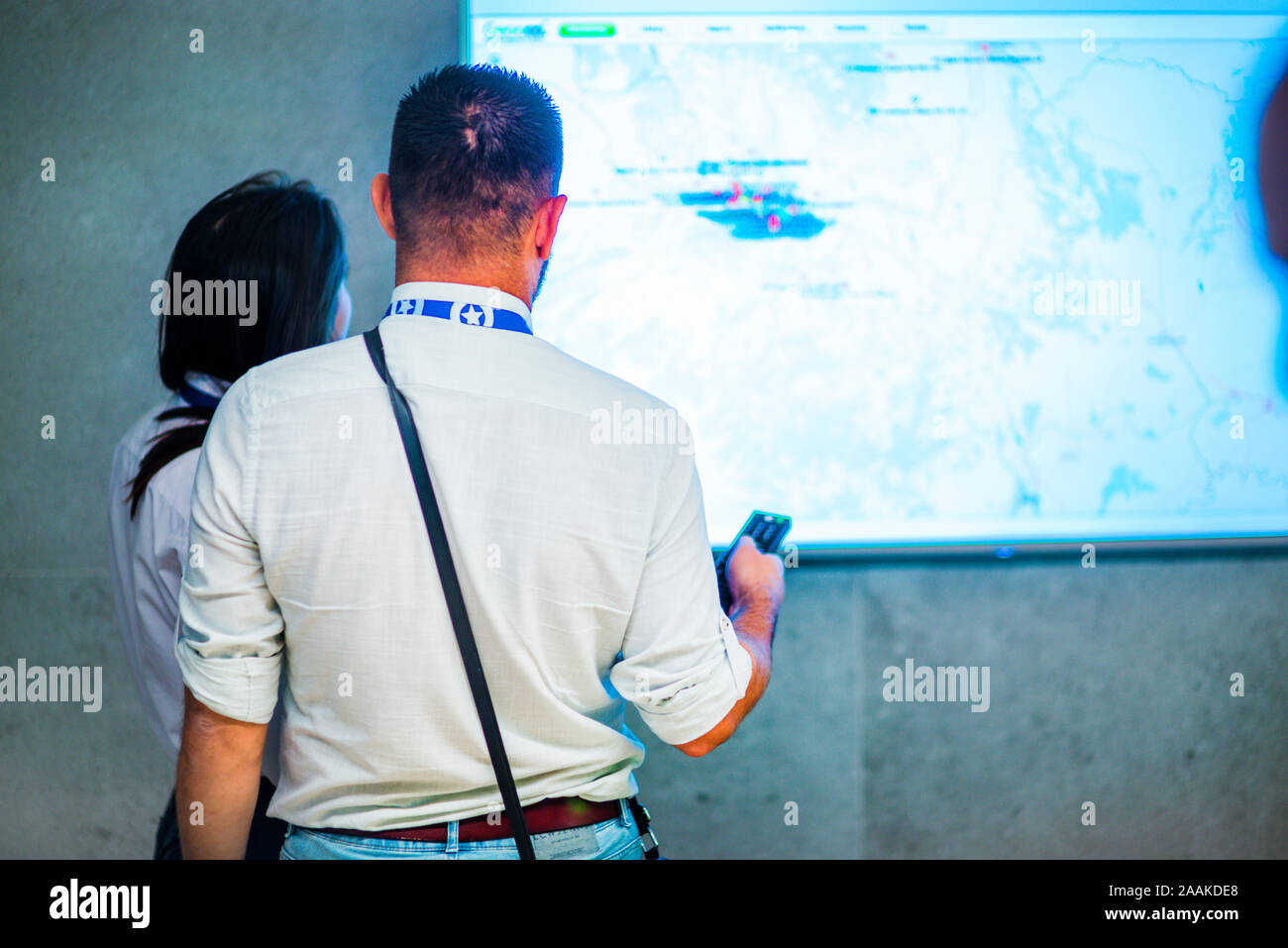 Security guards and policemen holdng portable transmitter having ...