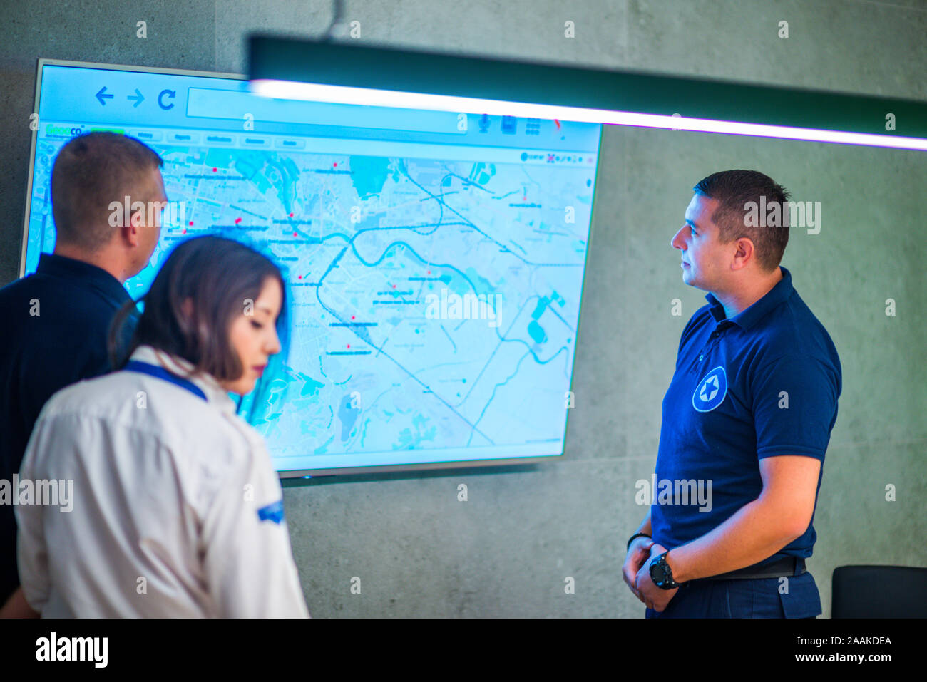 Security guards and policemen holdng portable transmitter having ...