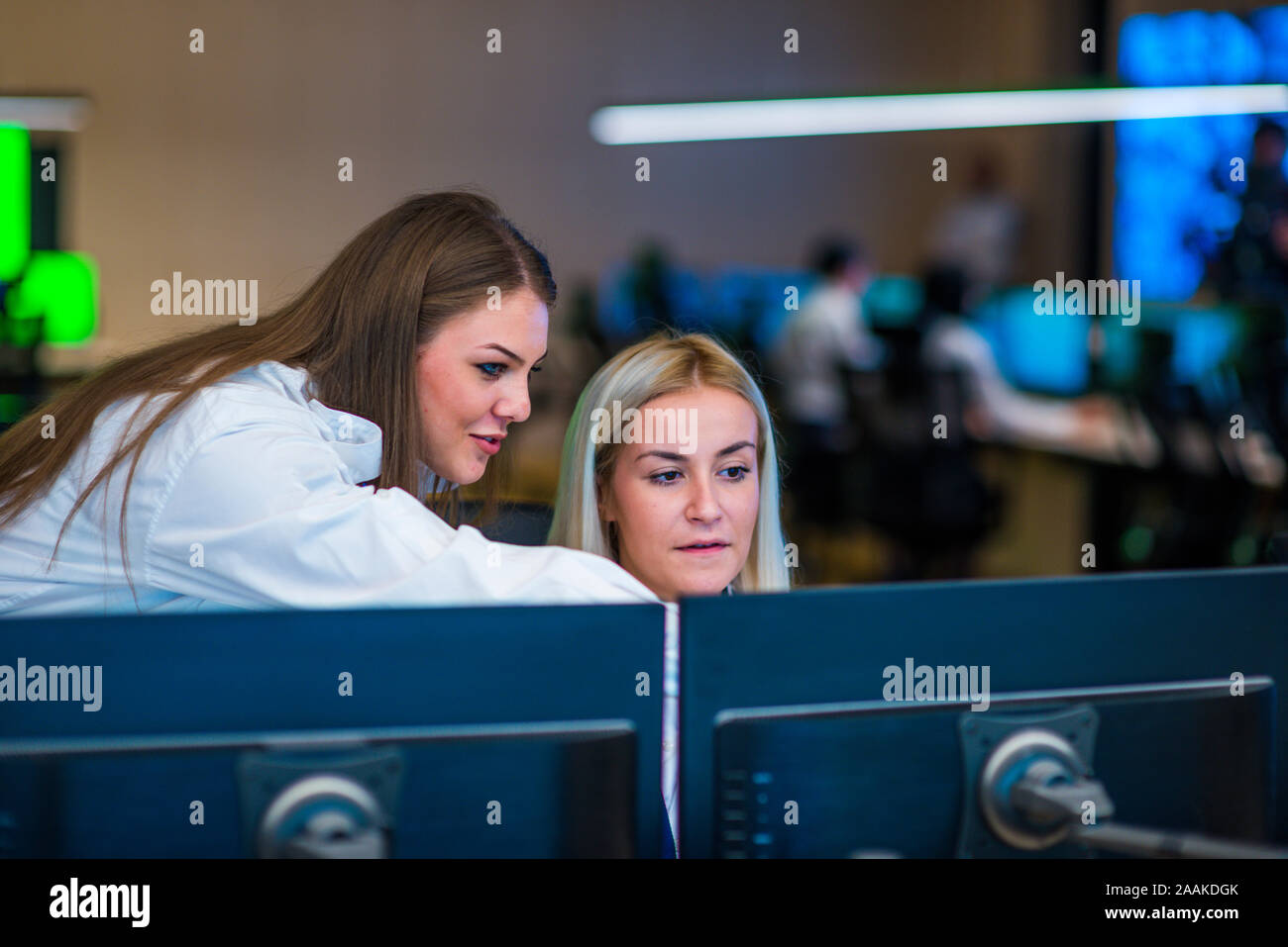 Female security guards working in surveillance room, monitoring cctv ...