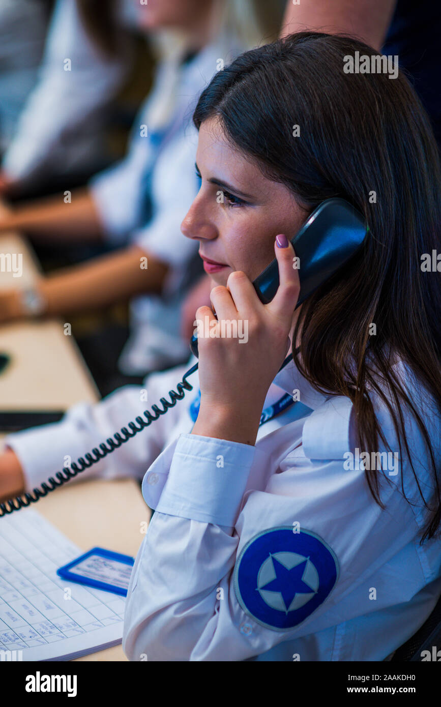 Security guards working in surveillance room. Female security guard ...