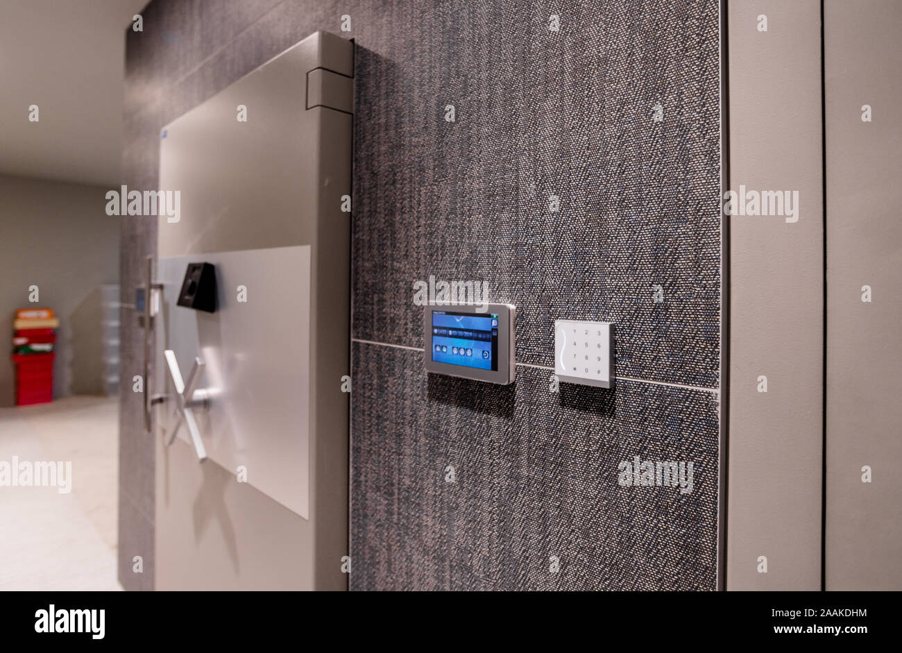 Vault door made of metal with numeric keypad and a touchscreen ...
