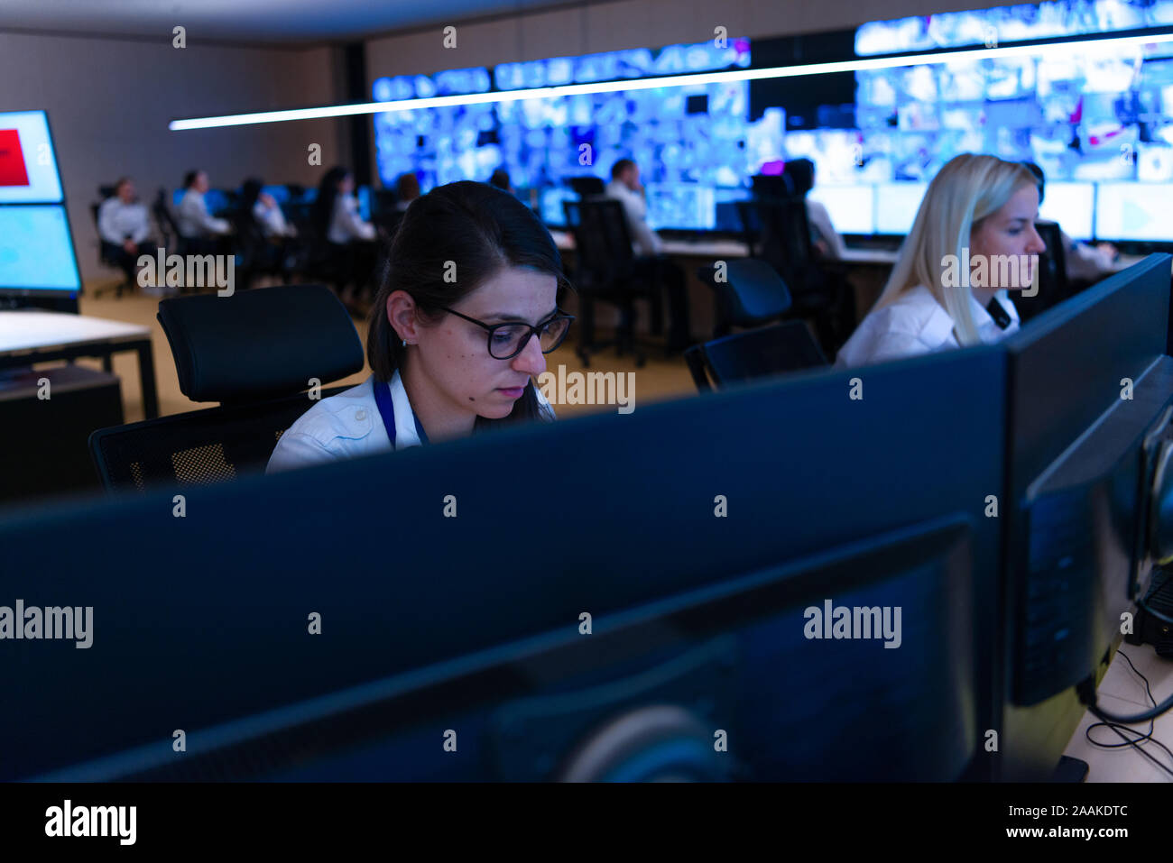 Technical Operator Works at His Workstation with Multiple Displays ...
