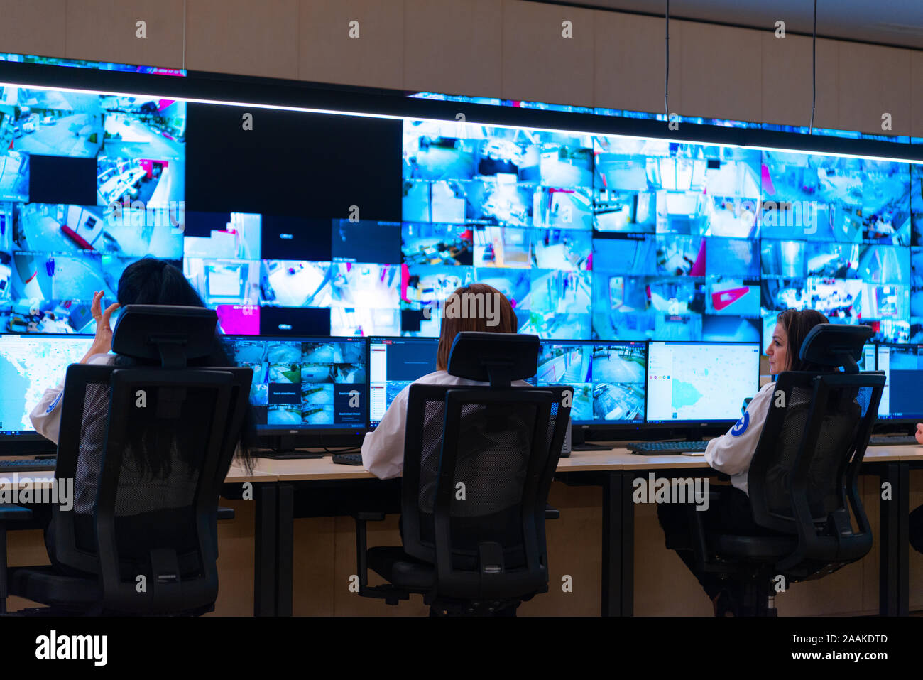 Team of secret agents in uniforms, monitoring cyber, video and ...