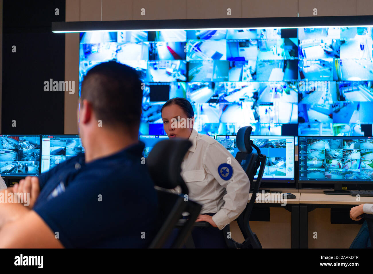 Team of secret agents in uniforms, monitoring cyber, video and ...