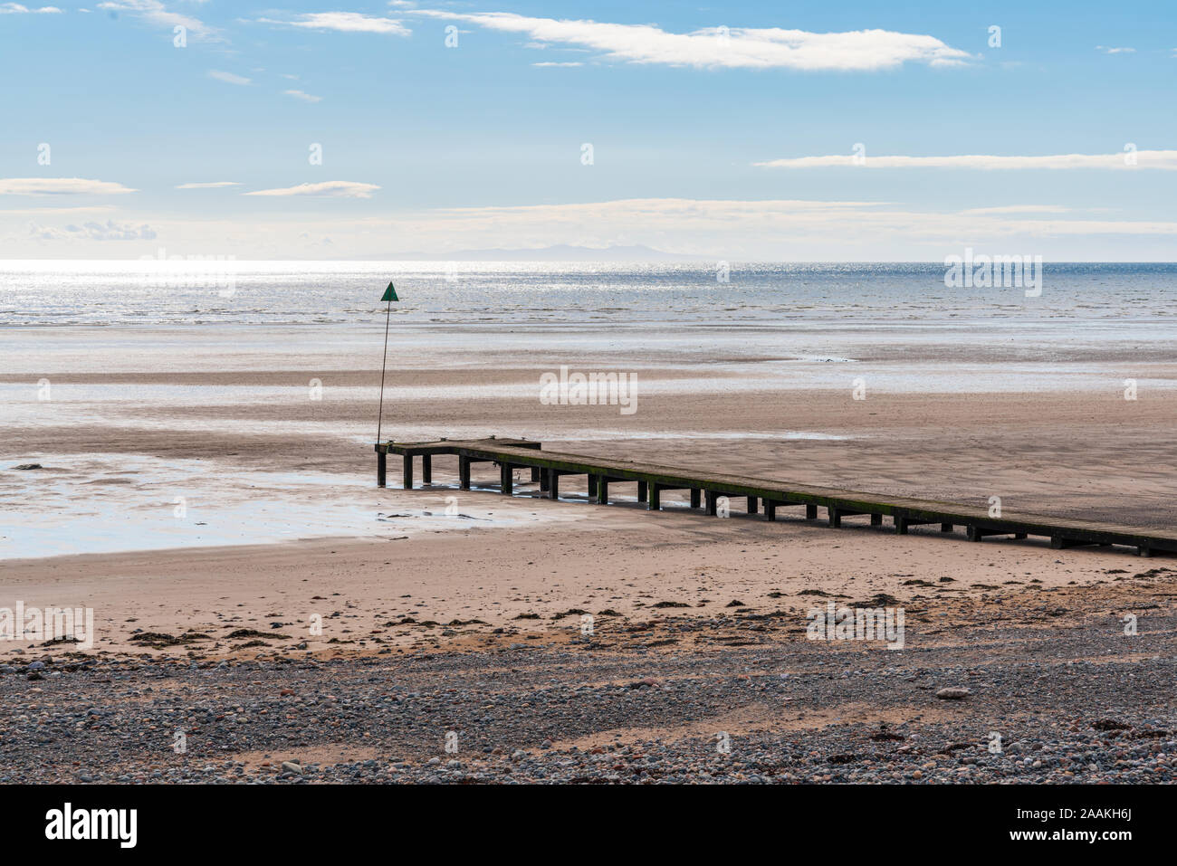 The beach and a wooden walkway in Seascale, Cumbria, England, UK Stock ...