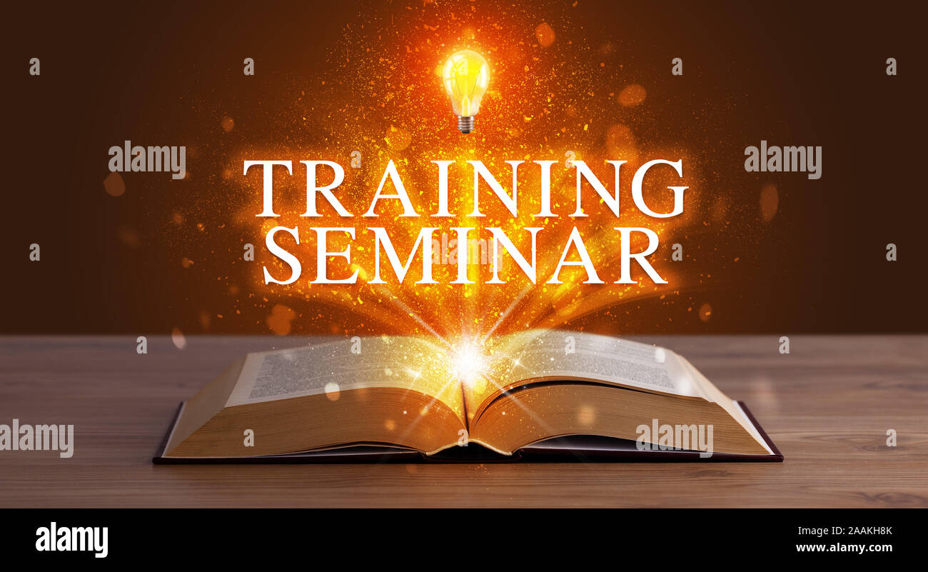 TRAINING SEMINAR inscription coming out from an open book, educational ...
