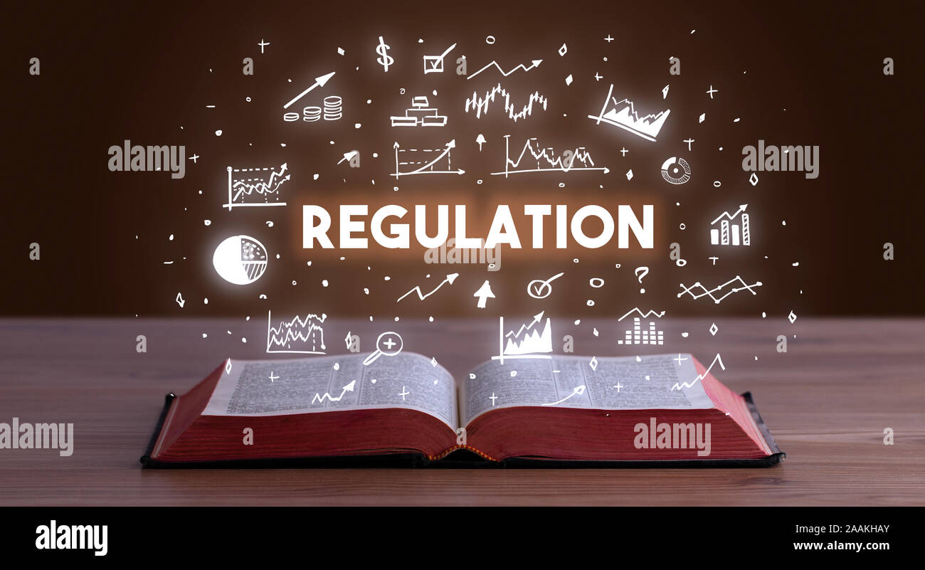 REGULATION inscription coming out from an open book, business concept ...