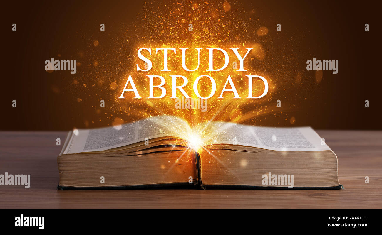 STUDY ABROAD inscription coming out from an open book, educational ...