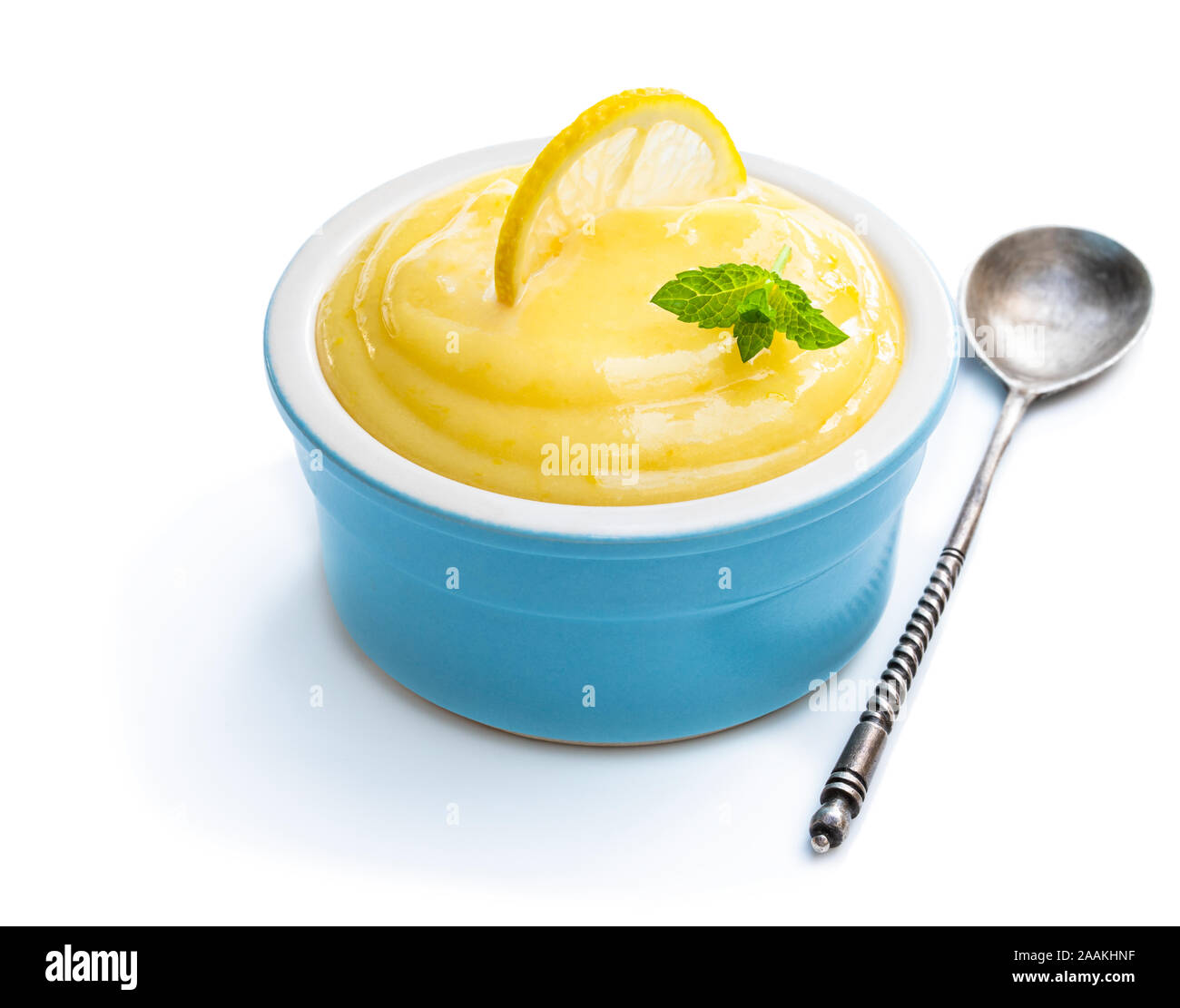 Homemade Lemon Curd in blue ceramic bowl isolated on white Stock Photo ...