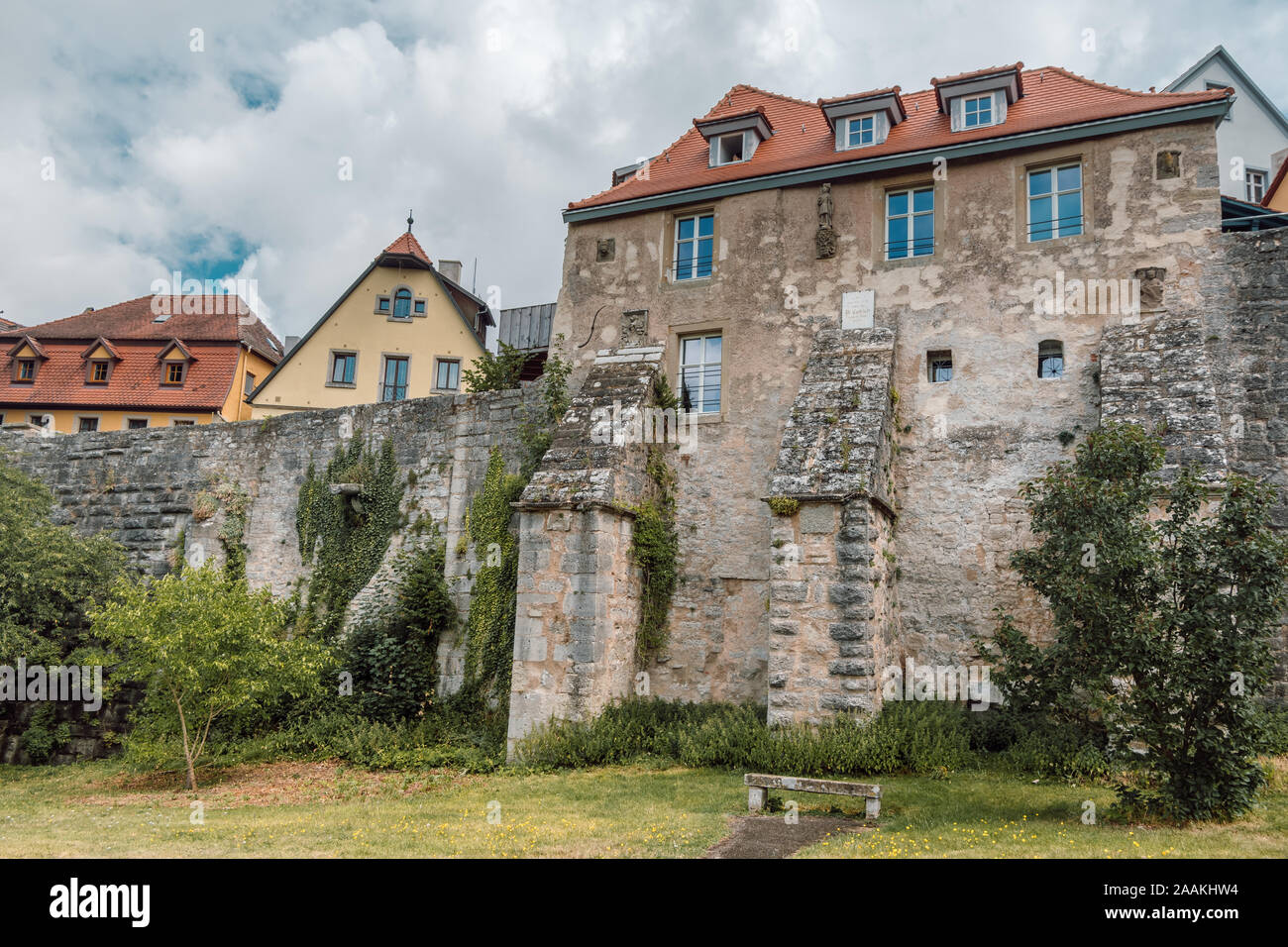 An old stone house and the fortification walls of a medieval German ...