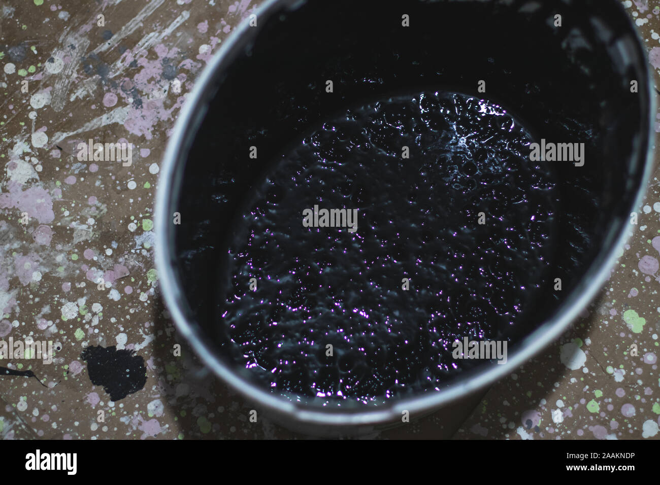 Black paint in a bucket Stock Photo - Alamy