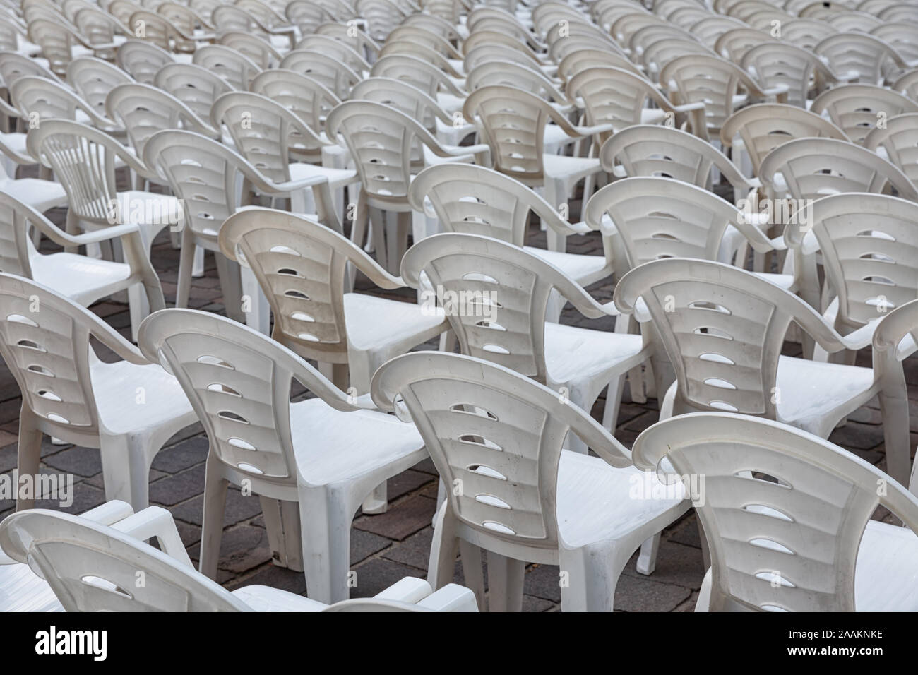 Row of plastic chairs hi-res stock photography and images - Alamy