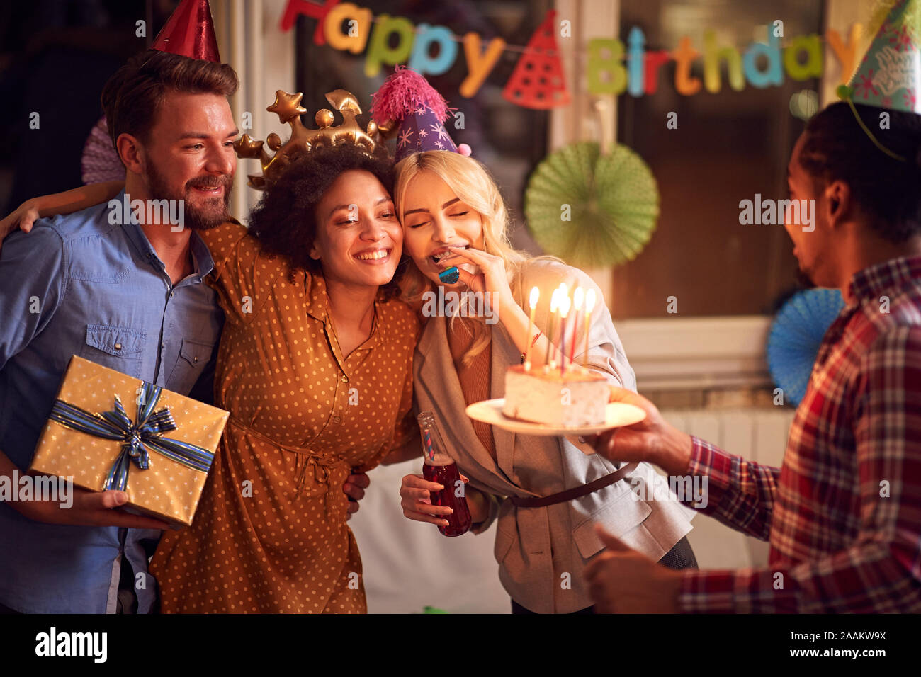 Birthday party for the young girl.Happy friends celebrating birthday ...