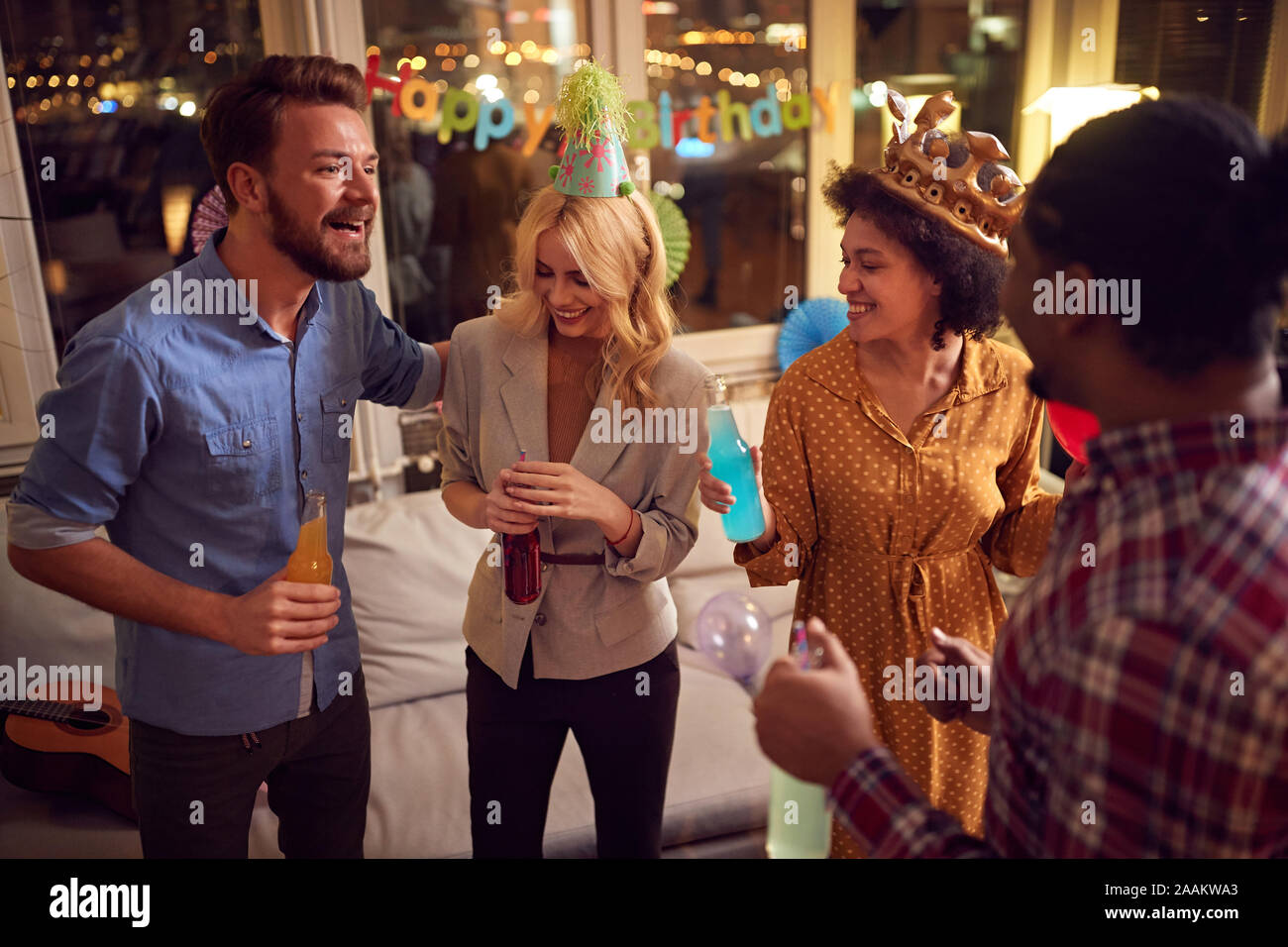 birthday party.Smiling friends celebrating birthday together Stock ...