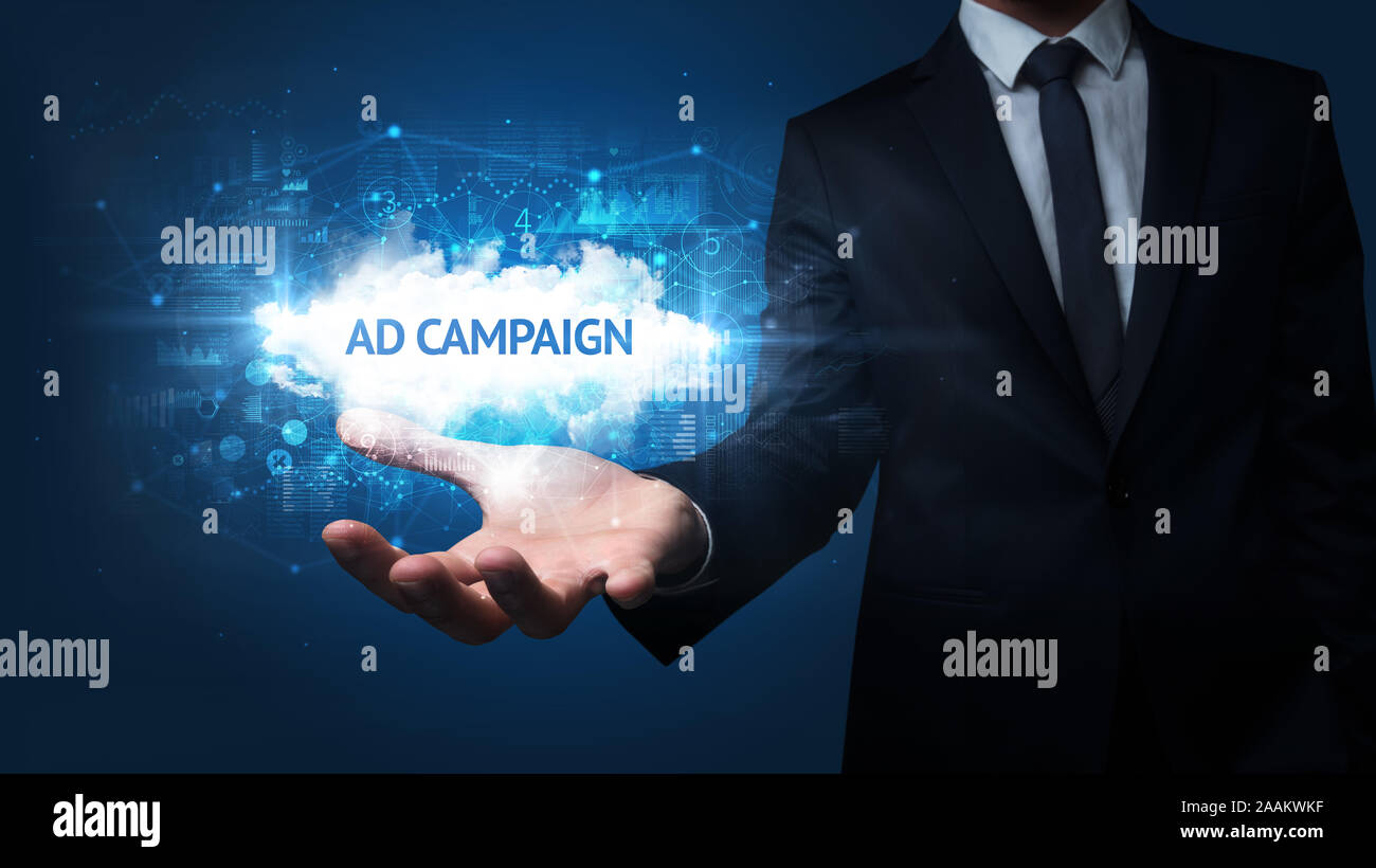 Hand of Businessman holding AD CAMPAIGN inscription, successful ...