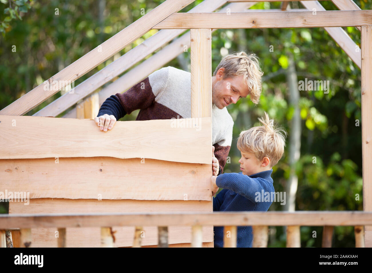 Father son building treehouse hi-res stock photography and images - Alamy