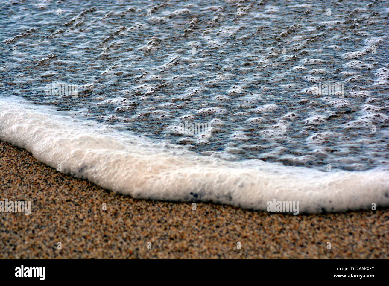 wave over the sand on the beach Stock Photo - Alamy